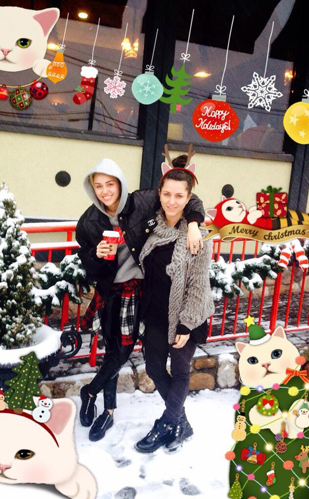 Miley Cyrus Rings In The Holidays By Freeing Her Nipples Hangs With Slutty Santas And More Cats